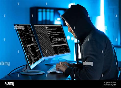 Hacker Using Computer To Write Cyber Security Exploit Software Program