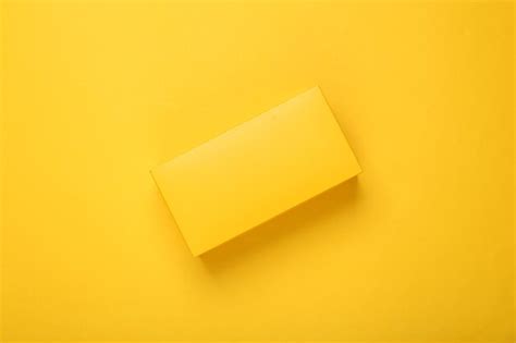Premium Photo Yellow Box Mockup On Yellow Background