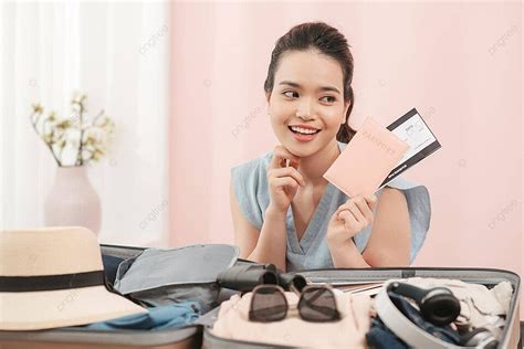 Traveling With Approval Woman Displays Passport And Thumbs Up Gesture