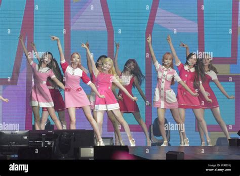 Members Of South Korean Girl Group Izone Stylized As Izone Perform