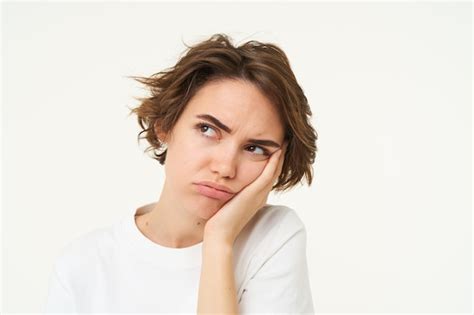 Free Photo Portrait Of Young Bored Woman Leans Head On Hand And