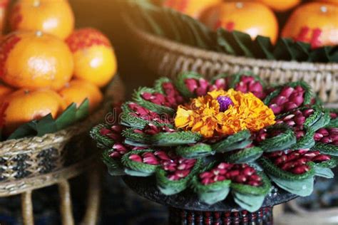 Marigold And Rose Flowers In Vase Made Of Banana Leaf In Traditional