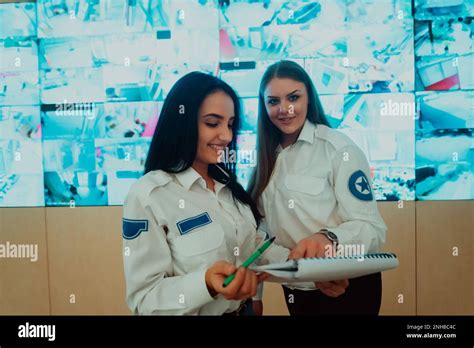 Group Portrait Of Female Security Operator While Working In A Data System Control Room Offices