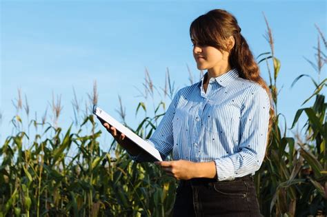 Premium Photo Beautiful Girl Agronomist With Note Book And Analyzes
