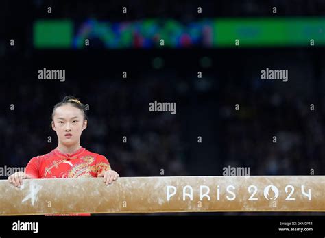 Zhou Yaqin Of China Looks On After She Fell Off The Balance Beam