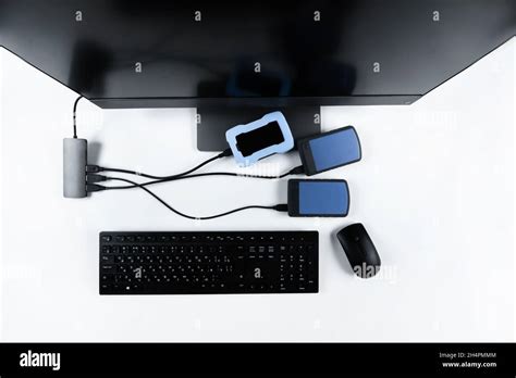 Multiple External Hard Drives Connected To A Monoblock On A White Background Computer With Hard