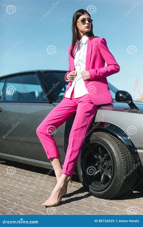 Fashion Girl Standing Next To A Retro Sport Car On The Sun Stylish
