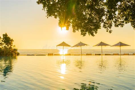 Beautiful Tropical Outdoor Beach Sea Ocean With Umbrella And Chiar