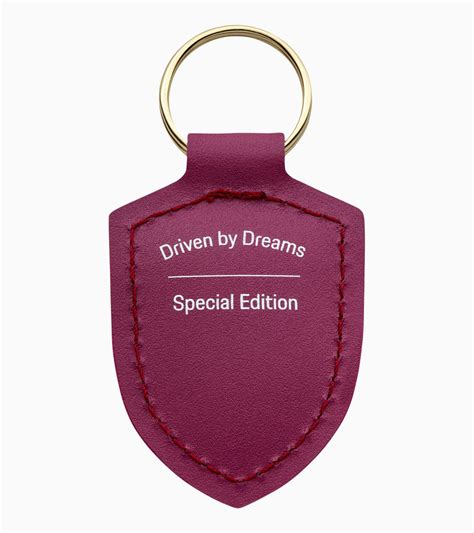 Llavero con escudo Ruby Driven by Dreams años Porsche Drivers Selection