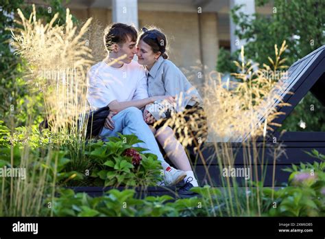 Young Couple Kissing On A Street Passionate Girl And Guy Embracing