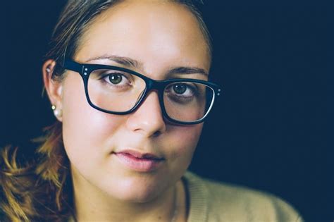 Premium Photo Close Up Portrait Of Young Woman Against Black Background