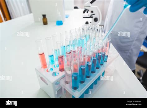 Vials For Science Close Up Of Many Vials Filled With Red And Blue Liquids And Placing In Stand