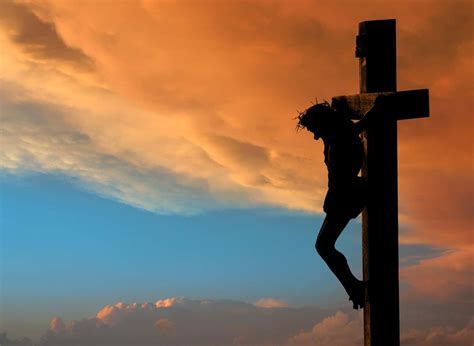 Download Jesus On The Cross With Orange Clouds Picture