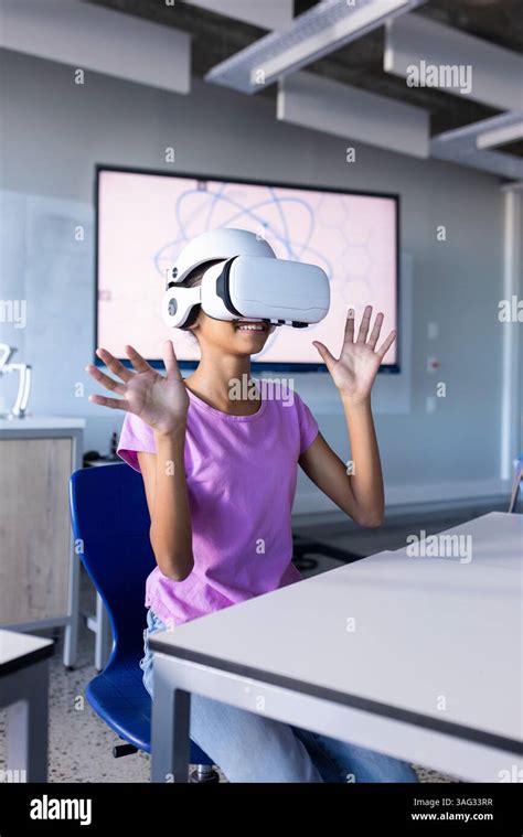 Using Vr Headset Student In School Classroom Experiencing Virtual