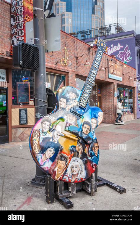 Guitar Painted With Country Music Legends Outside Legends Corner Bar In