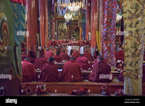 Tibetan Monks Inside The Gonchen Monastery In Dege Sichuan China