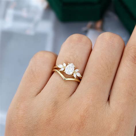 Pear Shaped Moissanite Cluster Engagement Ring With Plain Curved