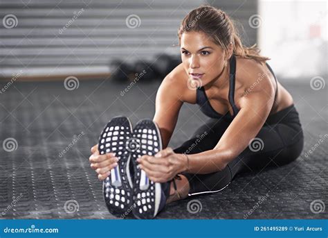 Prevent Injuries By Stretching Before A Workout A Young Woman