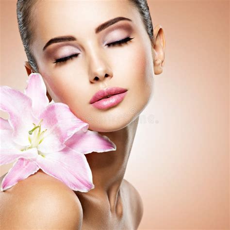 Beauty Pure Face Of The Young Beautiful Girl With Flower Stock Image