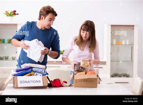 Concept of charity with donated clothing Stock Photo - Alamy