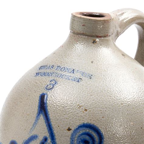 Bonhams Skinner Three Large Stoneware Advertising Jugs Massachusetts