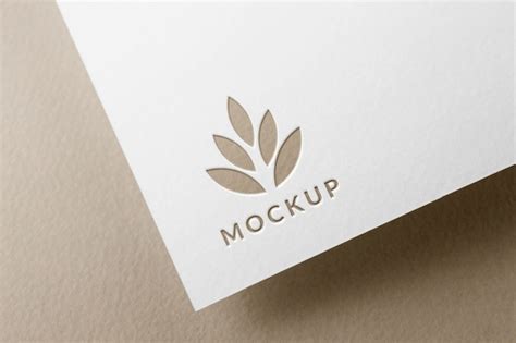 Premium Psd Cut Out Logo Mock Up On Paper