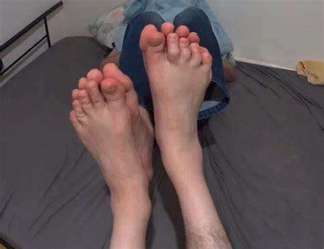 Two Friends Playing Barefoot Footsies