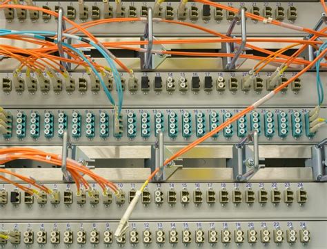 Premium Photo Network Switch With Fiber Optic Cable In A Data Center