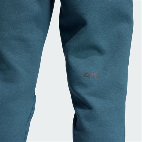 Clothing - Z.N.E. Premium Pants - Turquoise | adidas South Africa