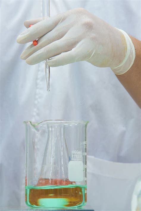 Researcher Doing The Experiment Titration Of The Reagent In The Stock
