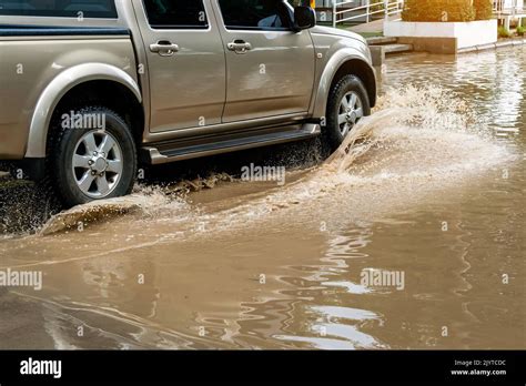 Pickup Truck Passing Through Flooded Road Driving Car On Flooded Road