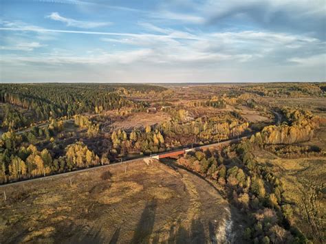 Russian Sparsely Populated Village Green Meadows And Dense Shrubs