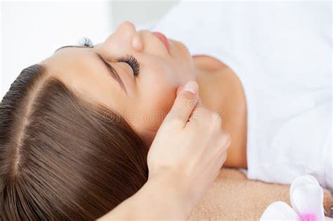 Beautiful Girl Has A Facial Massage In A Beauty Clinic Stock Image