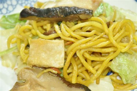 Stir Fried Yellow Noodles With Cabbage And Tofu Vegetarian Food On Dish