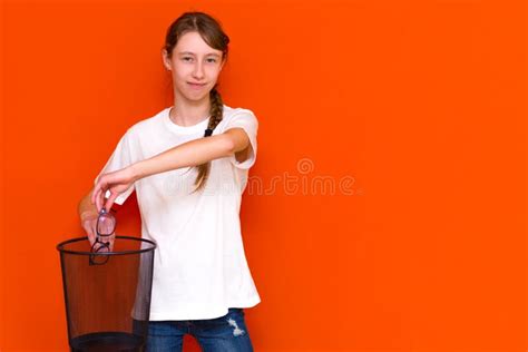Throw Glasses In Trash Bin Glasses In Hand In Front Of Trash Can