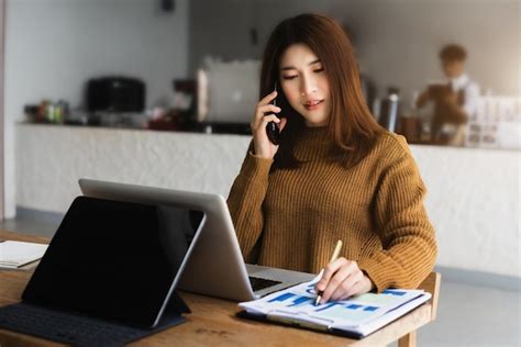 Premium Photo Women Working Laptop Computer And Holding Smartphone