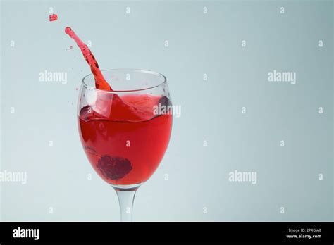 Raspberry Splashing Into Glass Of Wine Red Juice Drink Splash Water