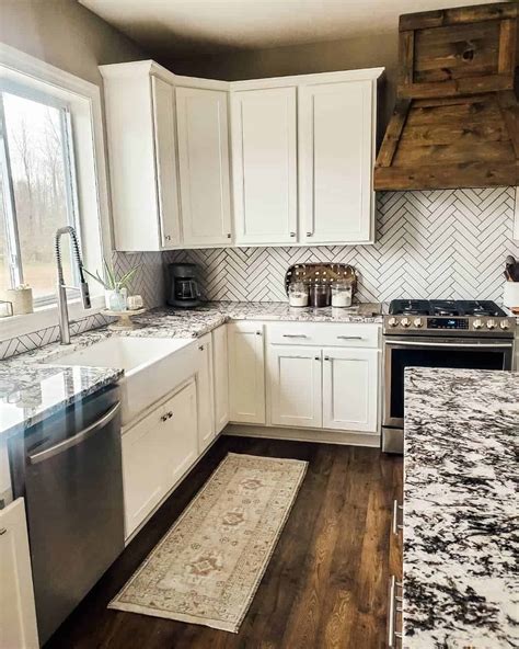 White Herringbone Backsplash For Busy Granite Countertops Soul And Lane