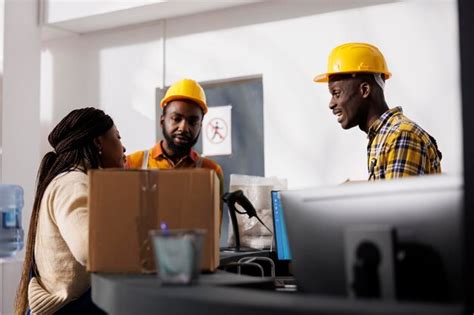 Premium Photo Delivery Service Employees Discussing Packages Storing