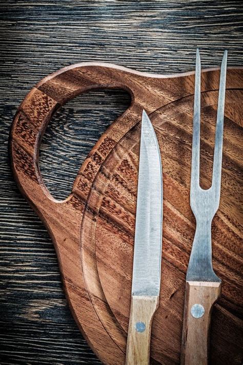Meat Fork Knife Wooden Carving Board On Wood Background Stock Image