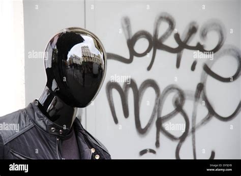 Black Mannequin With Reflection And Graffiti On Street In Belleville