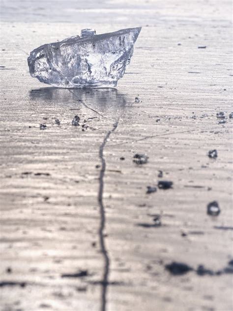 Ice Shards On A Frozen Lake The Rays Of The Sun Creat Rainbow Shadows