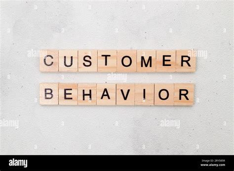 Top View Of Customer Behavior Word On Wooden Cube Letter Block On White Background Business