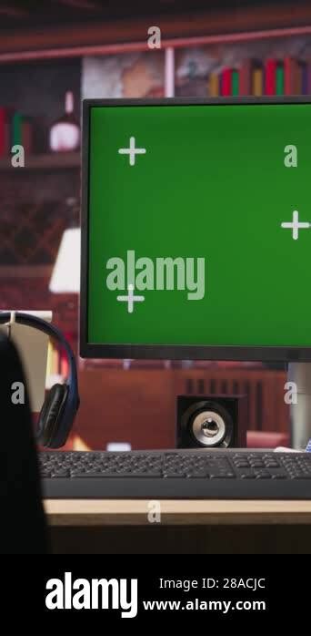 Vertical Video Green Screen Computer Monitor On Wooden Desk In Modern And Stylish Home Workspace