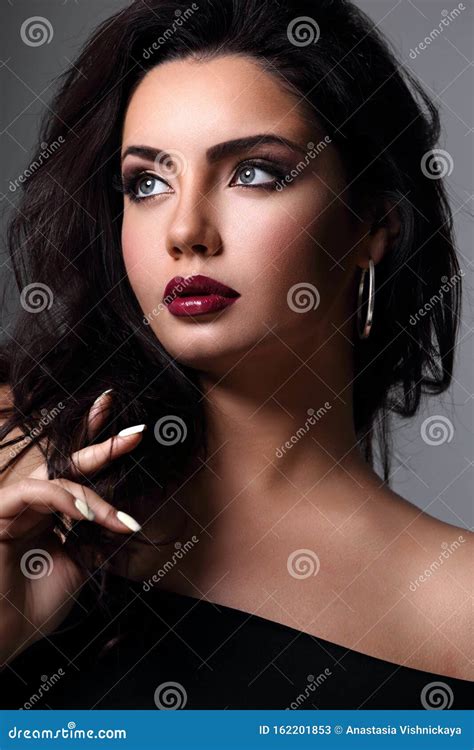 Beautiful Bright Makeup Woman With Long Black Curly Volume Black Hair