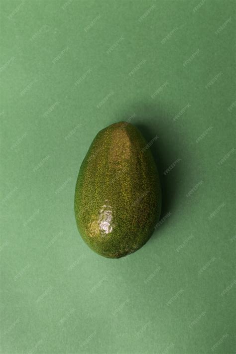 Free Photo Avocado Isolated On Green Surface