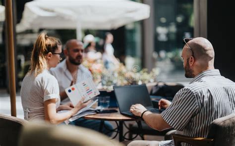 Startup Team In Business Meeting Discussing Brainstorming Analyzing And Strategizing At An