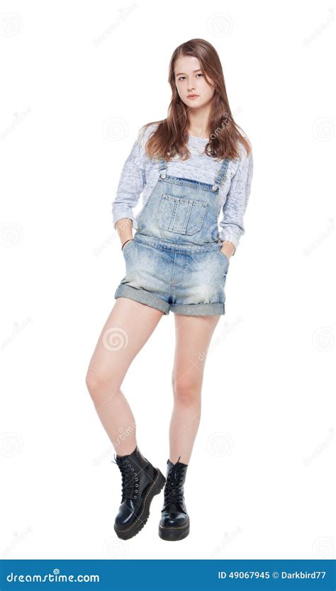 Young Fashion Girl In Jeans Overalls Posing Isolated Stock Image