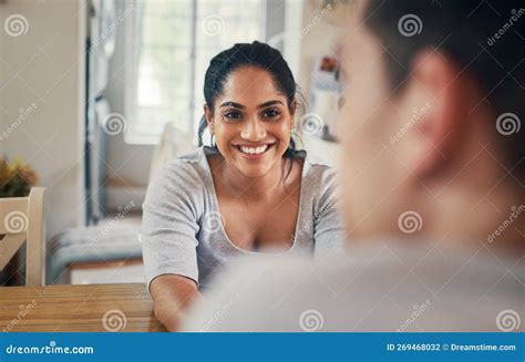 Im Madly In Love With Him A Young Woman Sitting At Home With Her