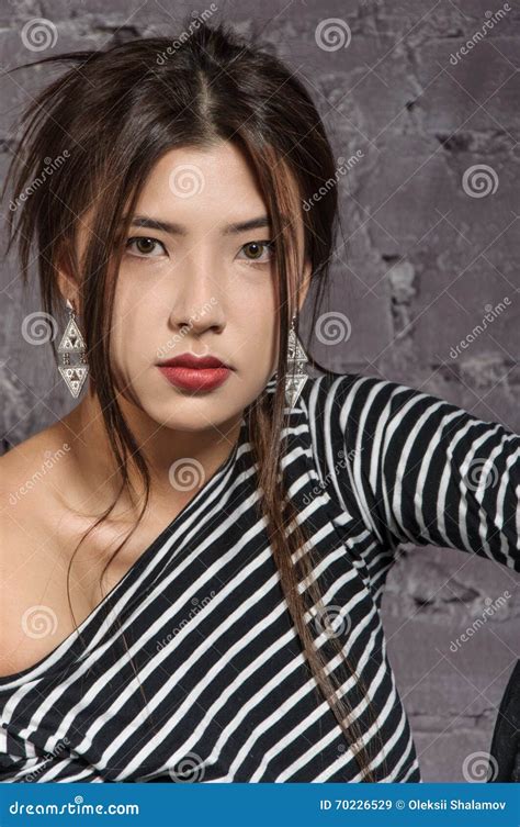 Portrait Of An Asian Girl Wearing A Striped Shirt Stock Image Image